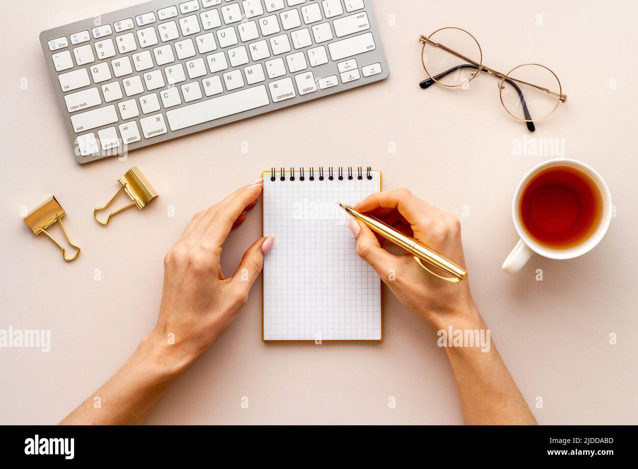 Hands on work place office desk. Home office table with supplies and ...