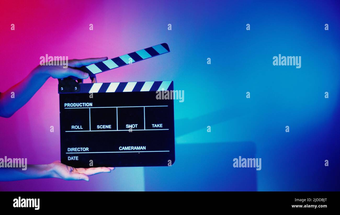 Movie Clapper board. Crew hand holding plastic and wooden film slate ...