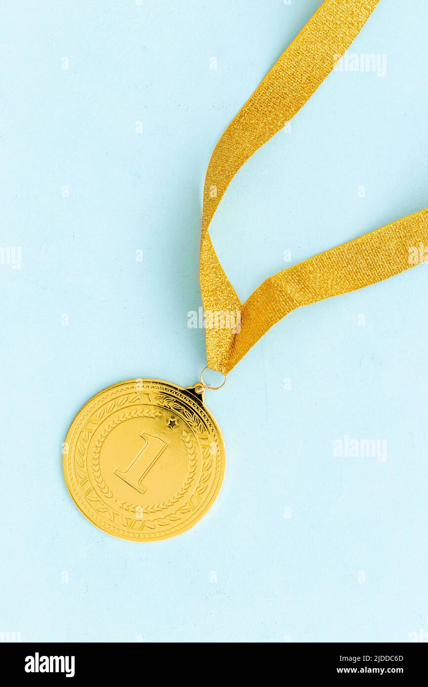 Gold medal first place on ribbon. Winner or champion trophy Stock Photo ...