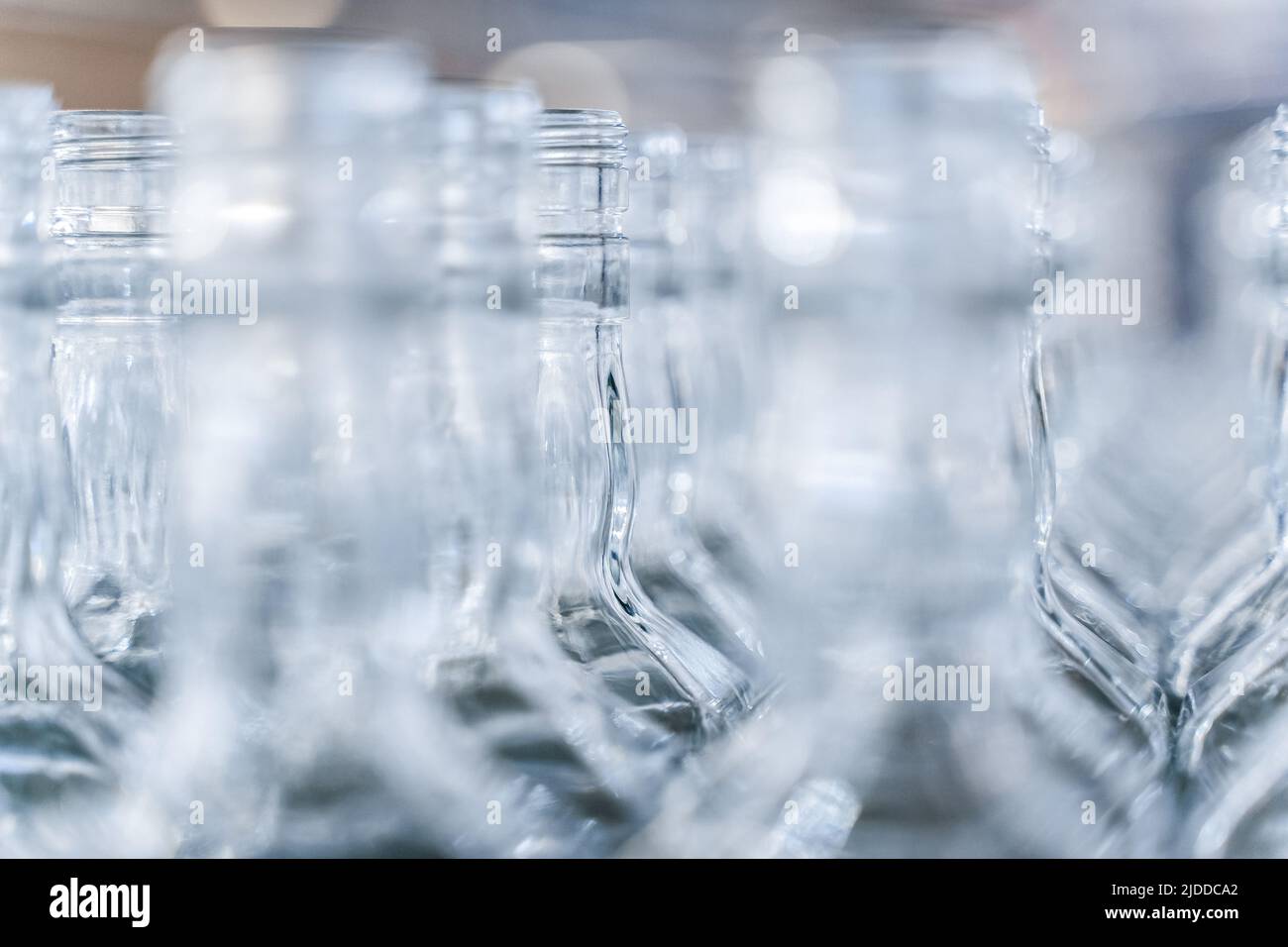 Beverage factory. Conveyor line with bottles for alcohol or water ...