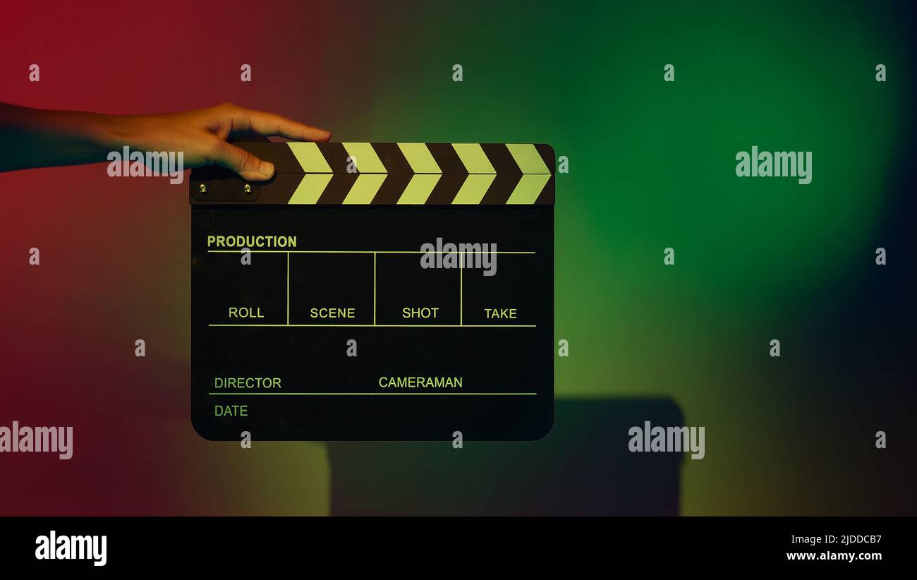 Movie Clapper board. Crew hand holding plastic and wooden film slate ...