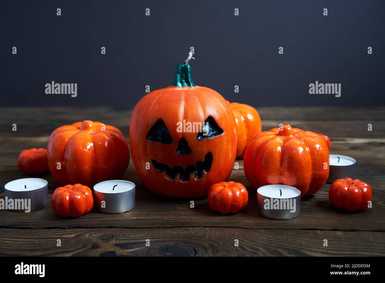 Halloween background, orange decorative plastic pumpkin black paper bat ...