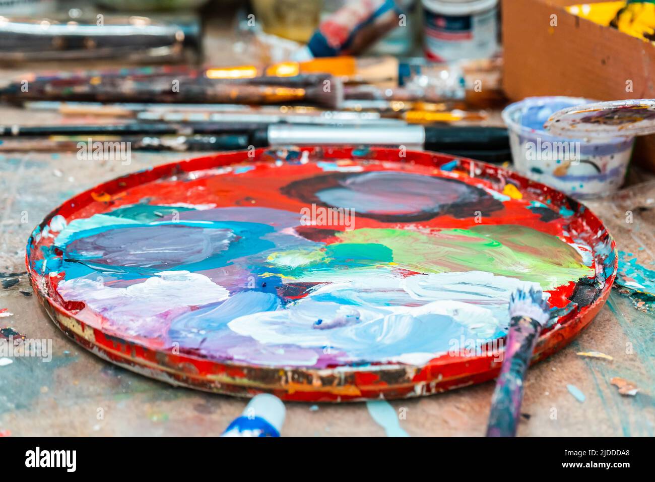 Bright spots of paint and brushes in an art workshop Stock Photo - Alamy