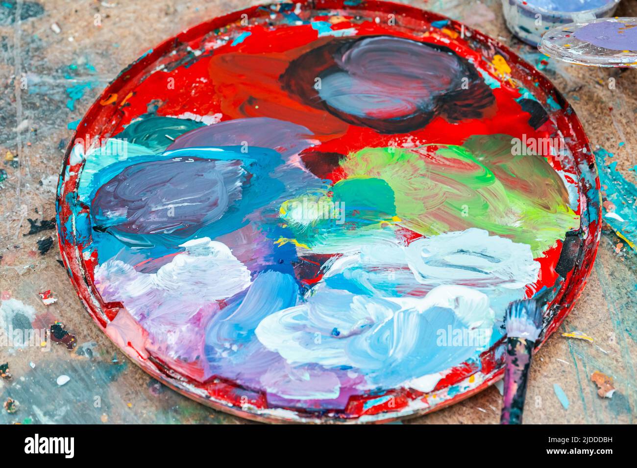 Bright spots of paint and a brush in an art workshop Stock Photo - Alamy