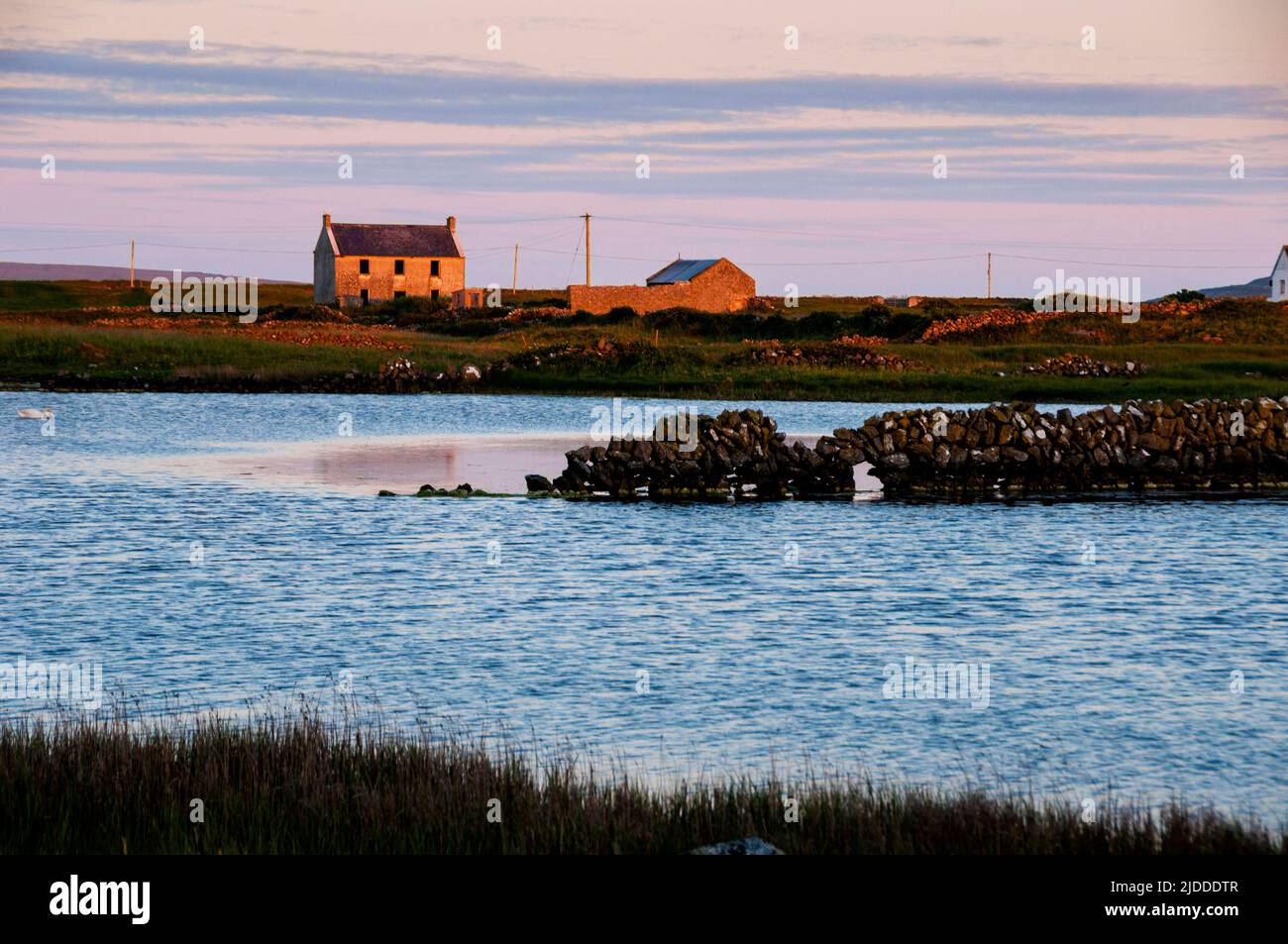 Coastal lagoon farmstead on the Aran Island of Inishmore in Galway Bay ...