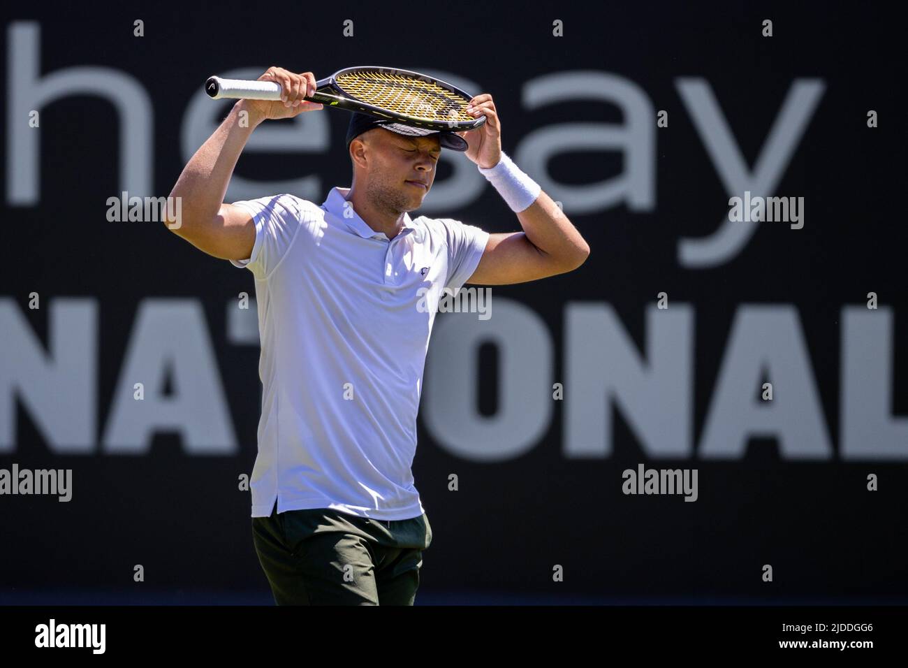Jay Clarke of Great Britain holding his racket above his head with ...