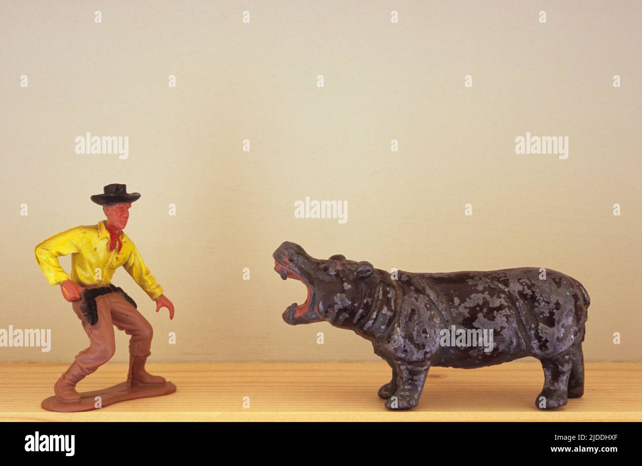 Plastic cowboy and lead hippopotamus hi-res stock photography and ...