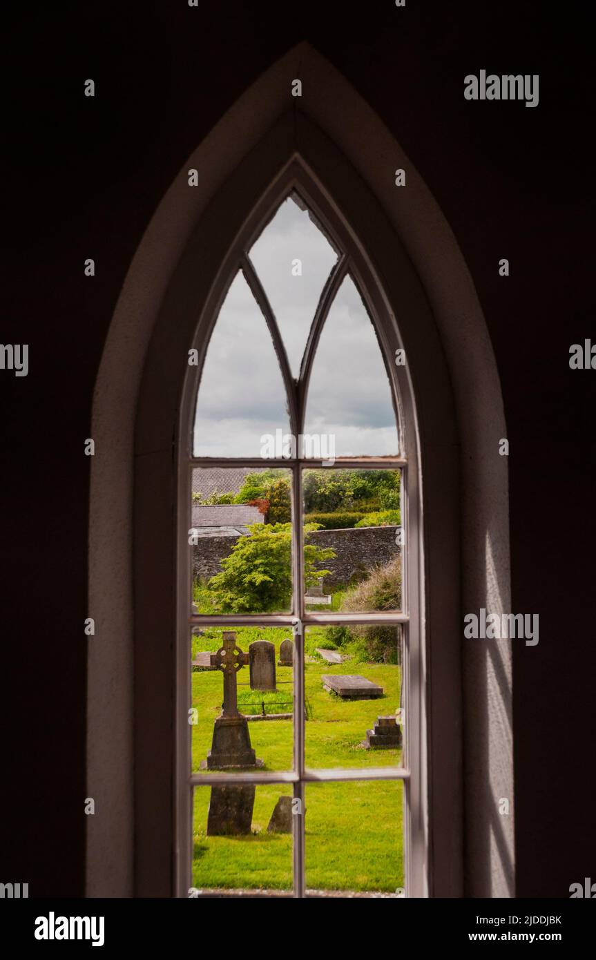 Pointed arched window and High Cross in Kells, Ireland Stock Photo - Alamy