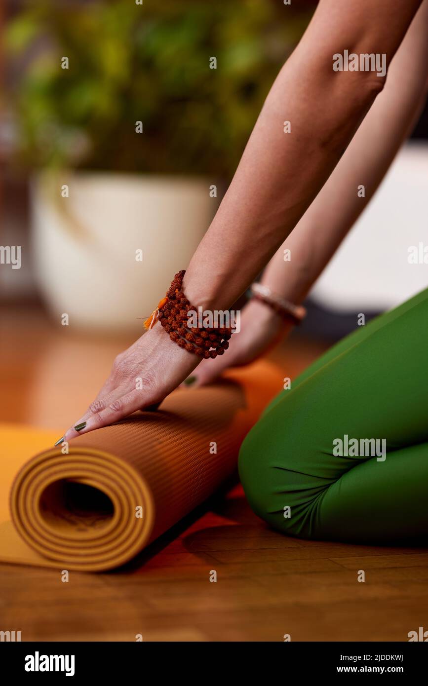 Female hands rolling yoga hi-res stock photography and images - Alamy