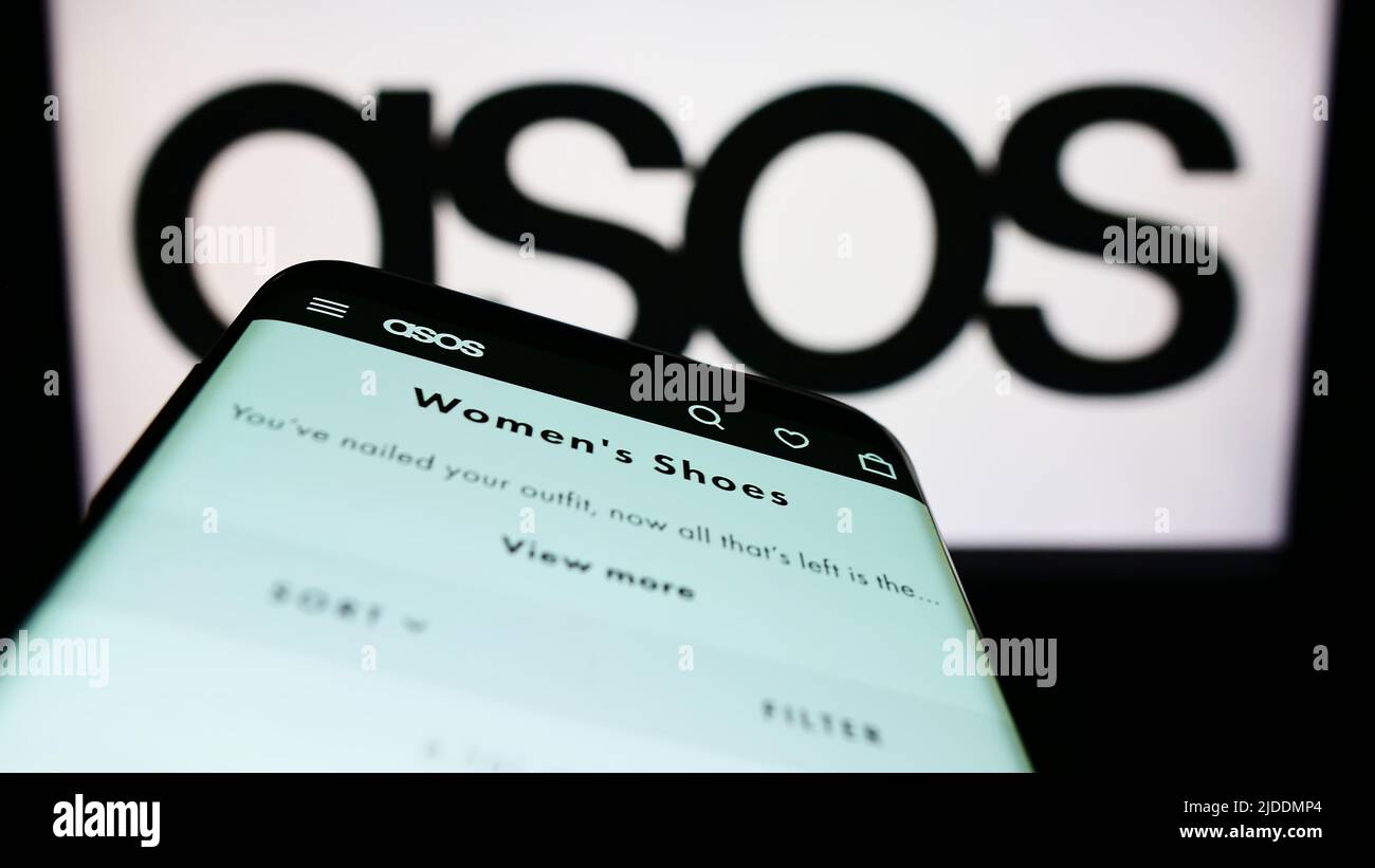 Mobile phone with webpage of British fashion retail company ASOS plc on ...