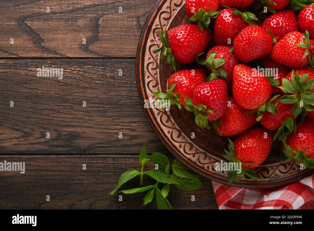 Strawberry berry. Fresh red strawberry in ceramic rustic plate in ...
