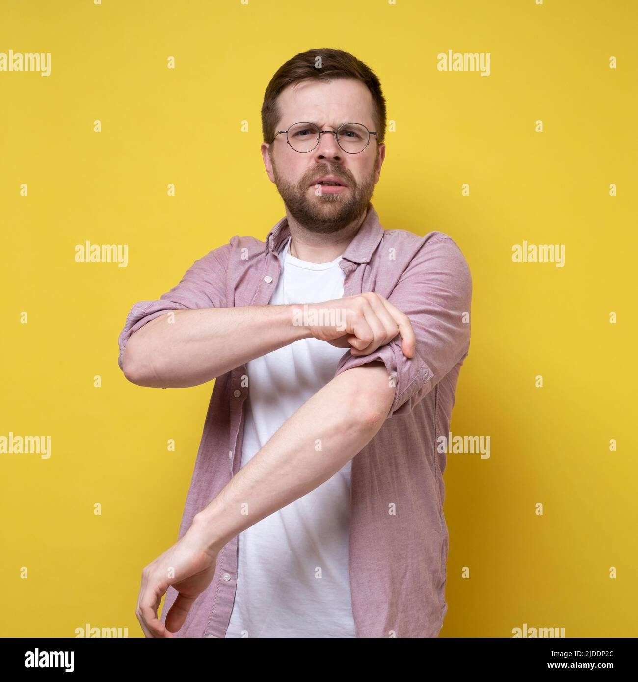 Man rolls up sleeves hi-res stock photography and images - Alamy