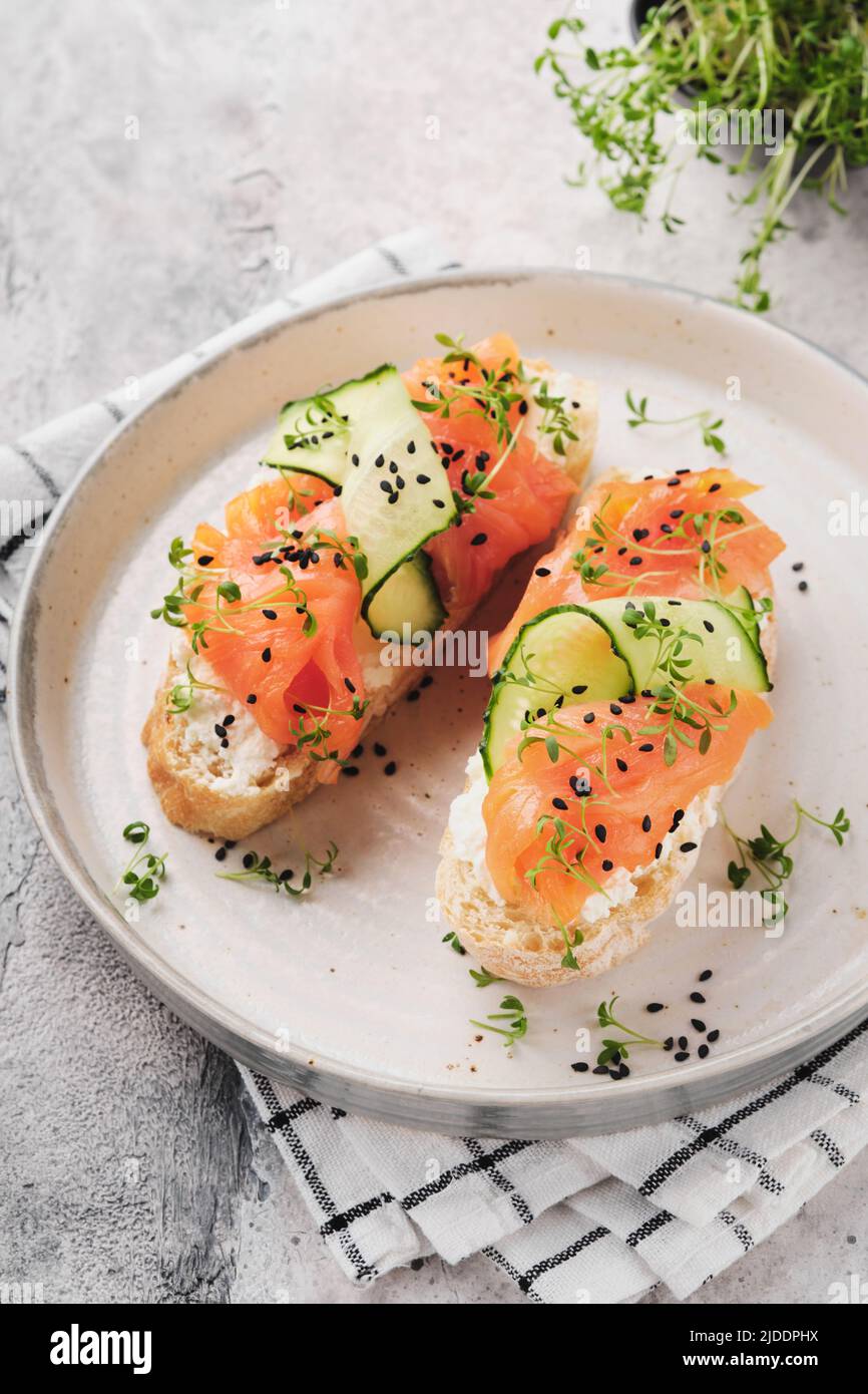 Sandwiches. Salmon toast with cream cheese, cucumber, black sesame and ...
