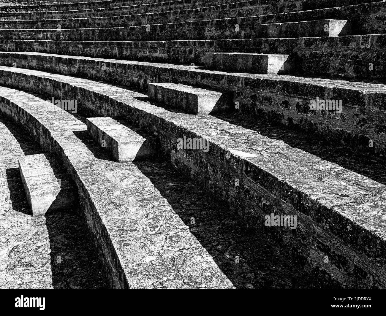 Stone seats in the ancient Roman ampitheater in Arles are still used ...