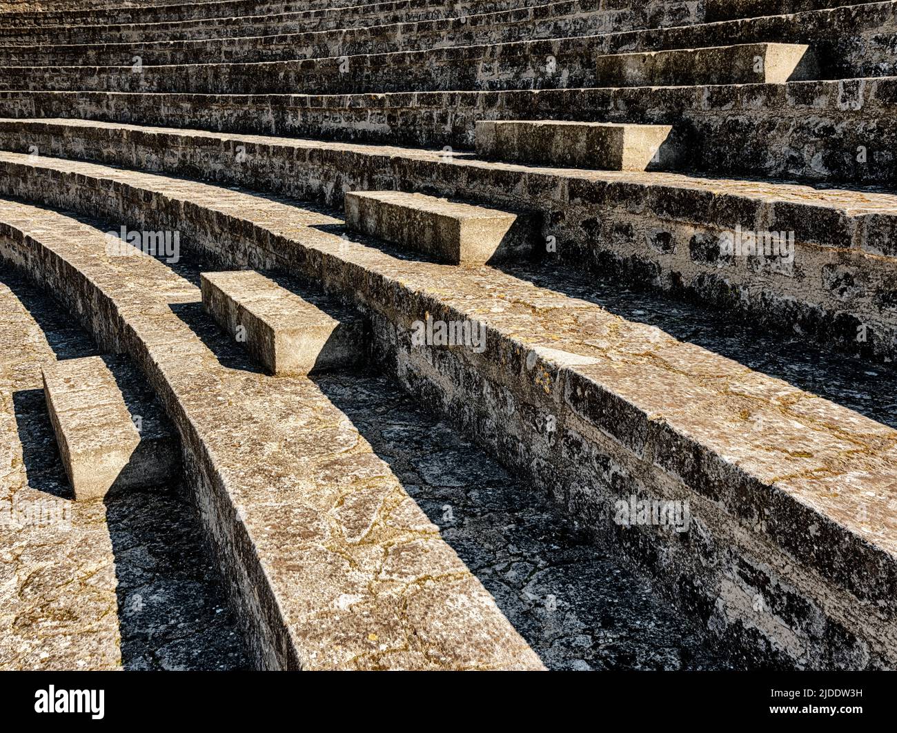 Stone seats in the ancient Roman ampitheater in Arles are still used ...