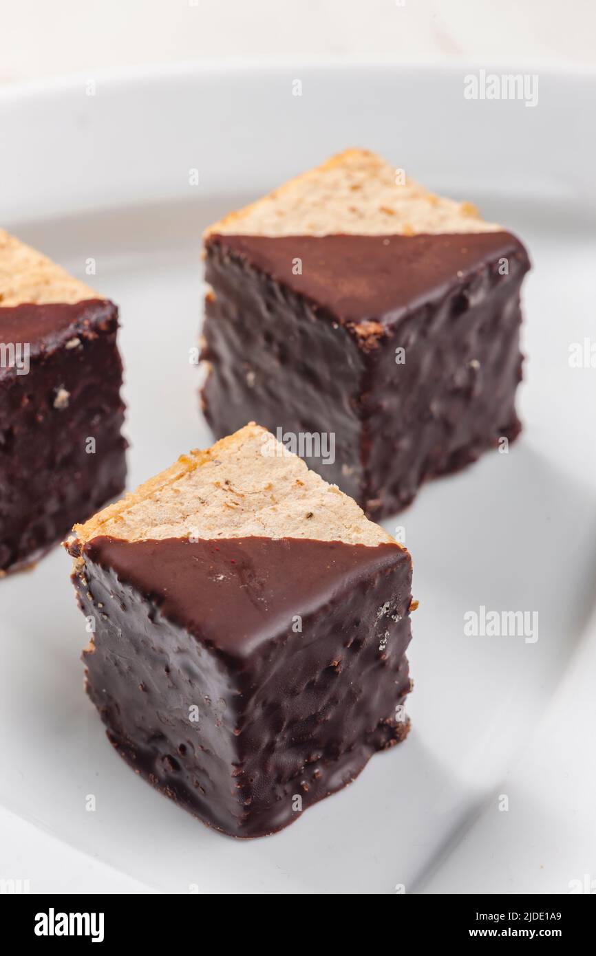 nutty sponge cakes with chocolate coating Stock Photo - Alamy