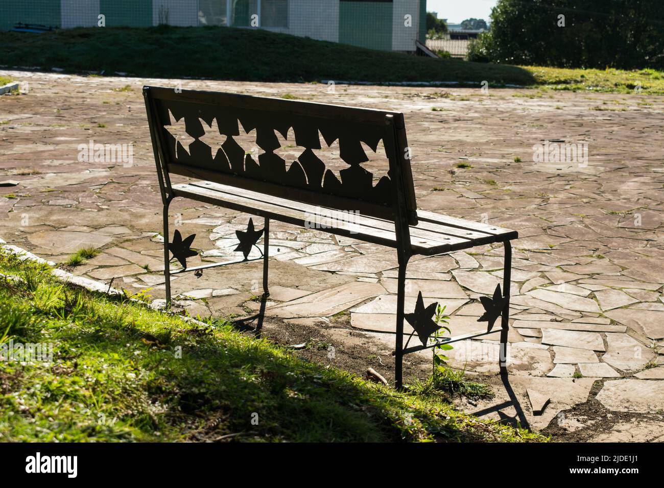 Bench decorated with shapes of Sweetgum (Liquidambar) leaves, a symbol ...