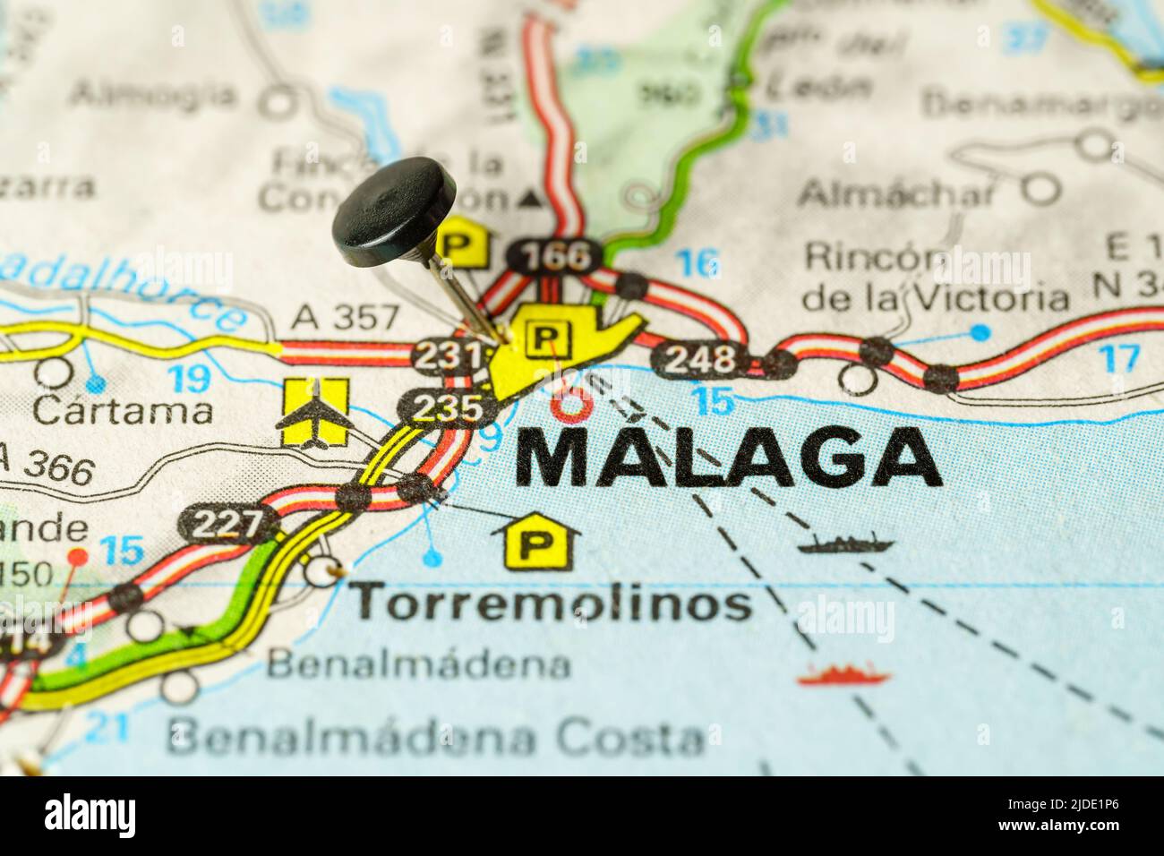 Tourist destination of Malaga with a pin on a map, macro photo Stock ...