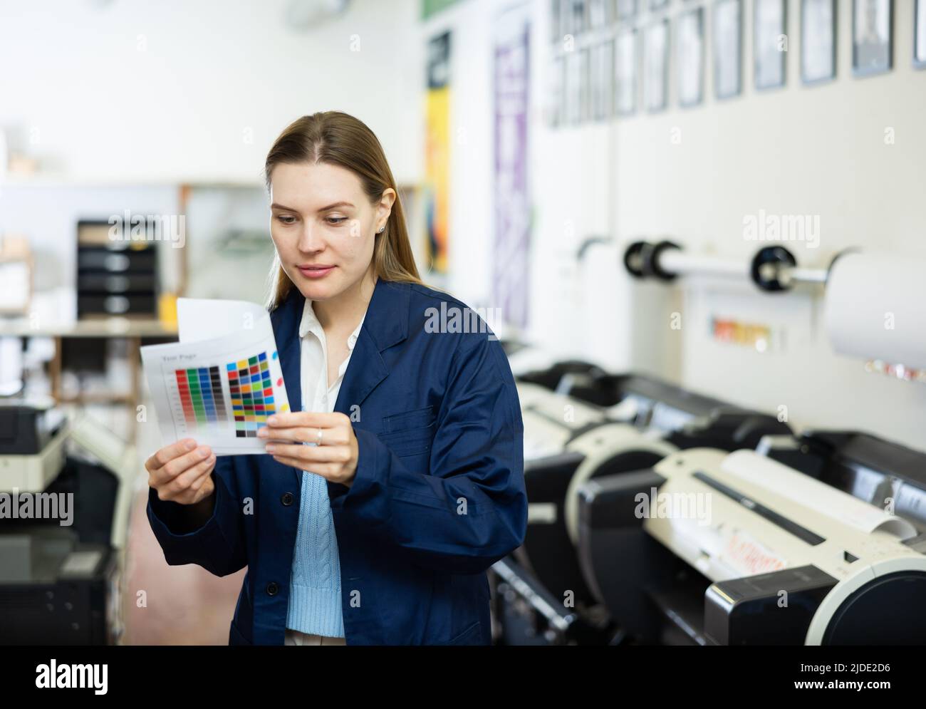 Woman employee of printing shop holds color chart in her hands Stock ...
