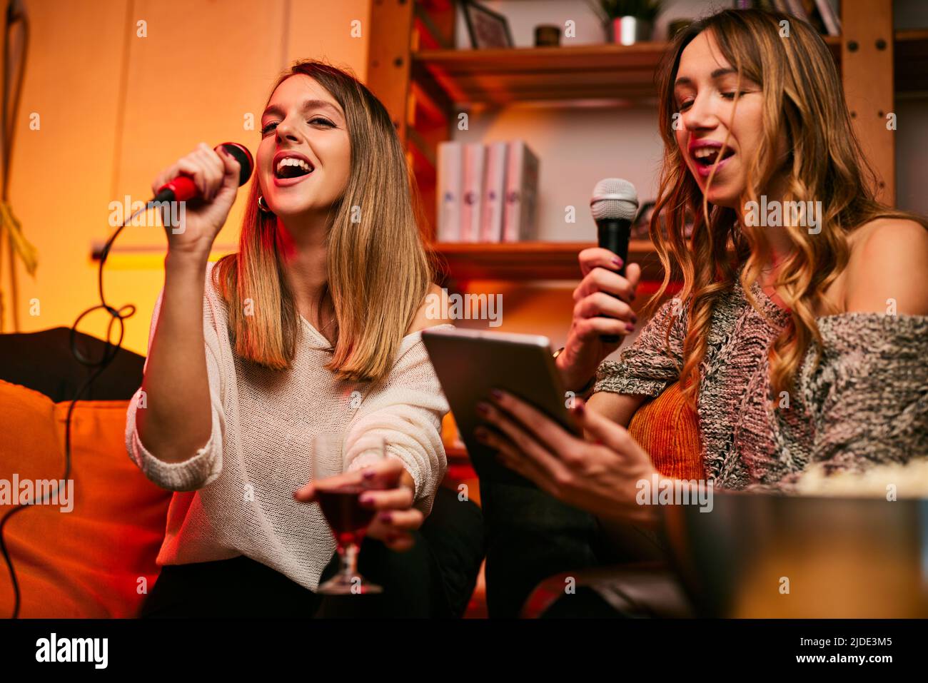 Two girls sing hi-res stock photography and images - Alamy