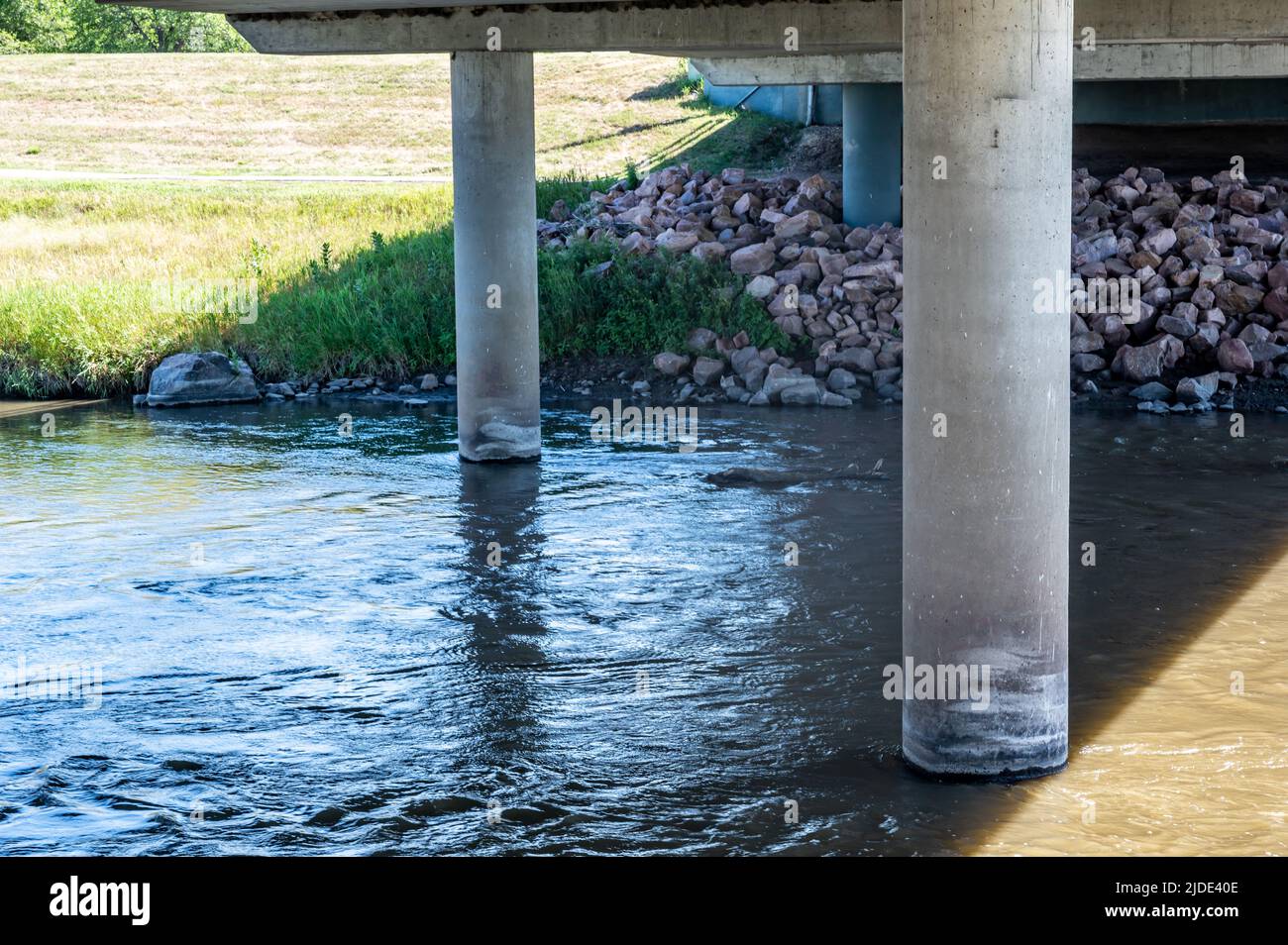 Column support under a bridge crossing over a waterway Stock Photo - Alamy