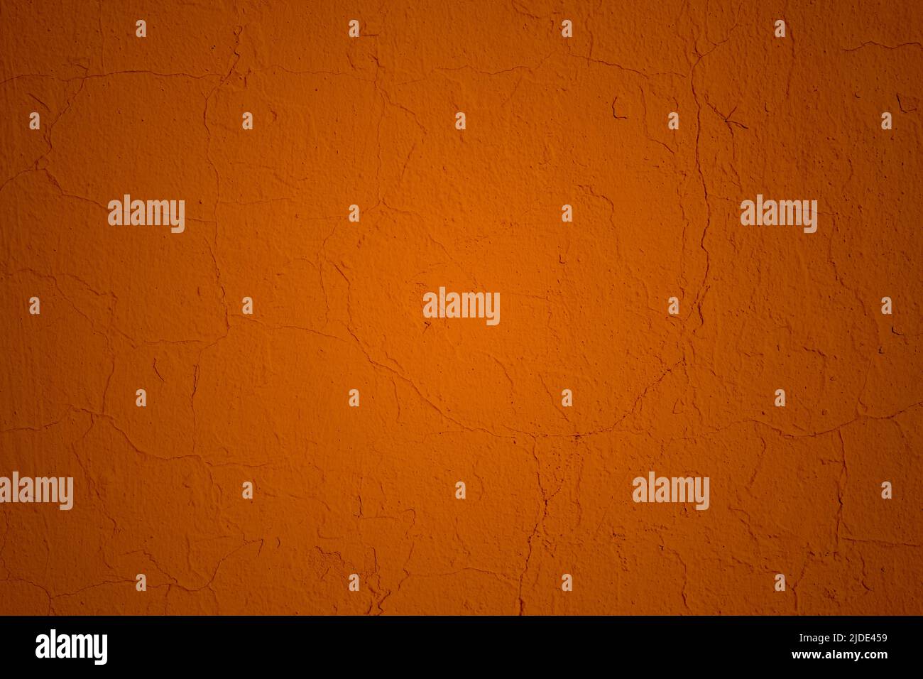 Orange rectangular background with cracked texture with a gradient in ...