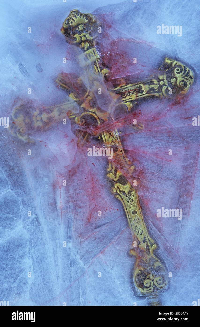 Ornate brass crucifix lying in ice and surrounded by blood Stock Photo ...