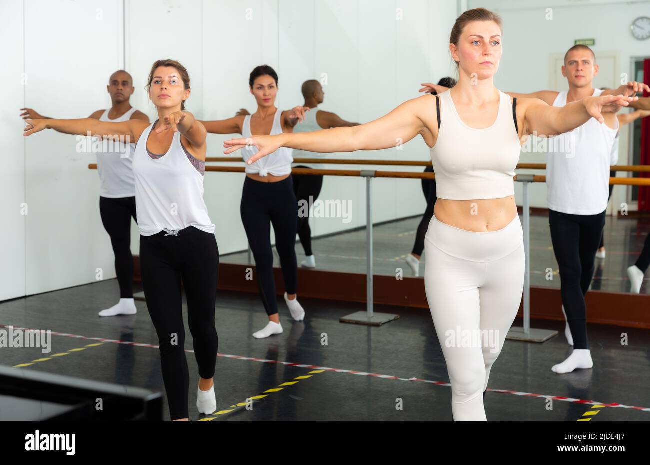 Multiethnic dancers practicing dance pose Stock Photo - Alamy