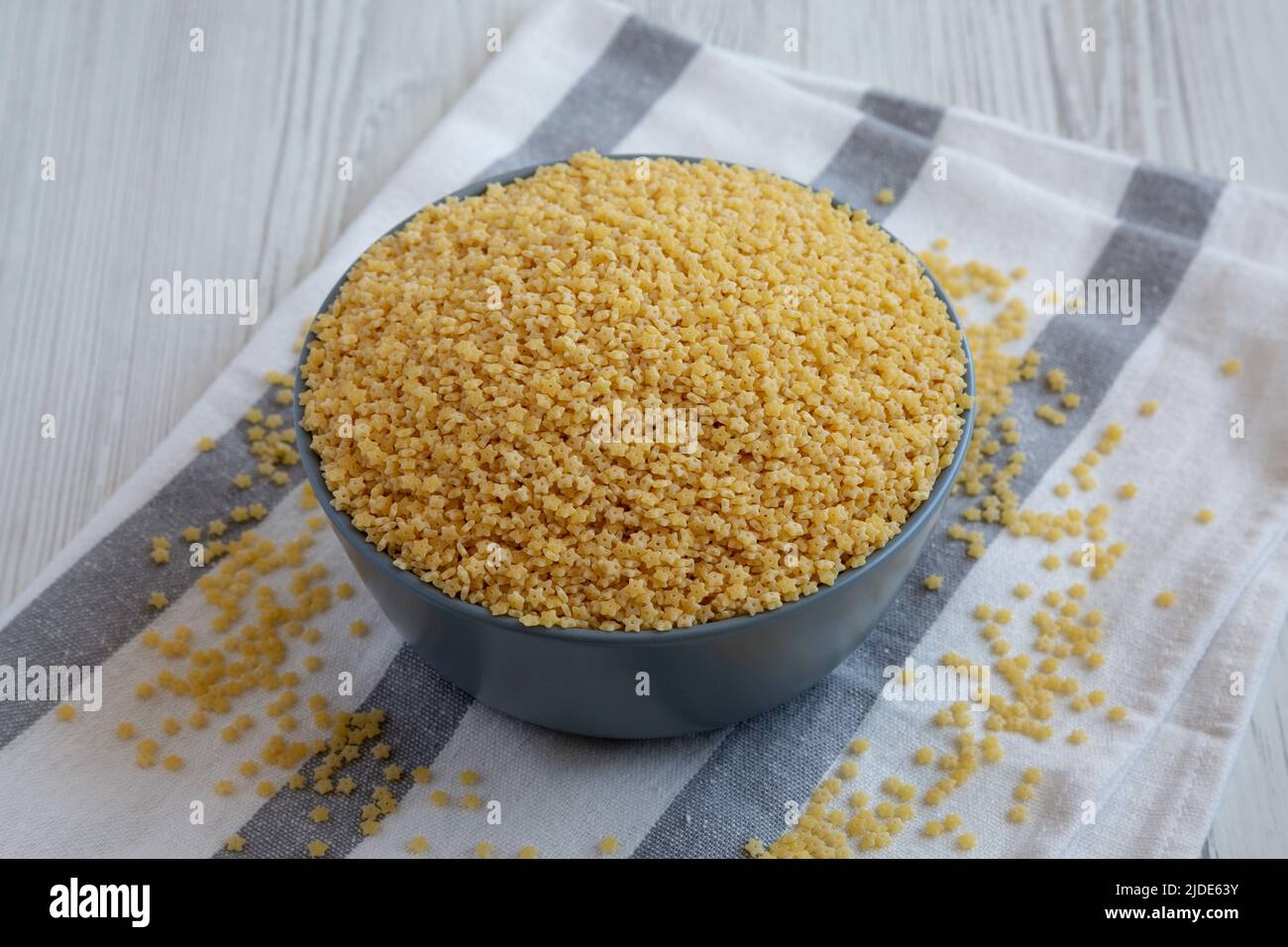 Raw Organic Stelline Pasta in a Bowl, side view Stock Photo - Alamy
