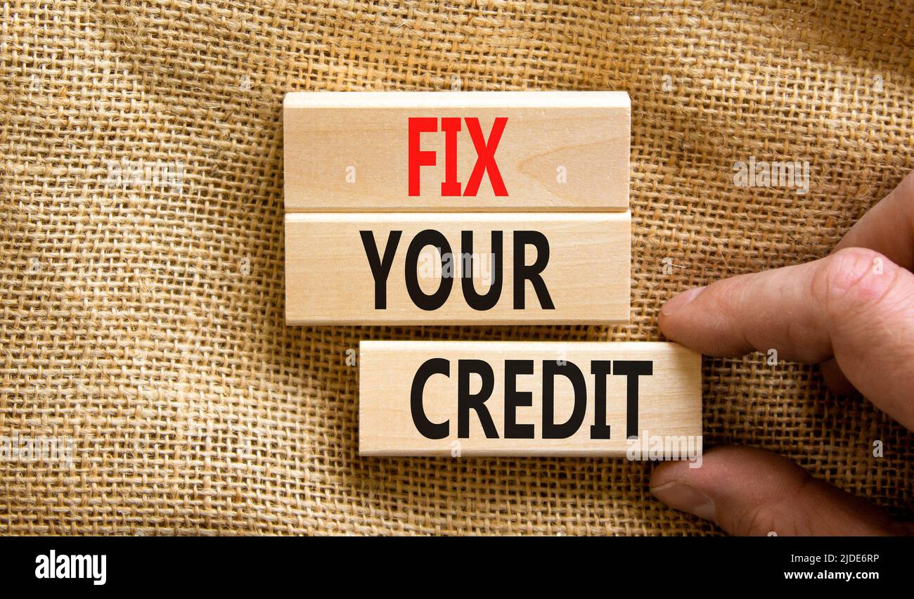 Fix your credit symbol. Concept words Fix your credit on wooden blocks ...