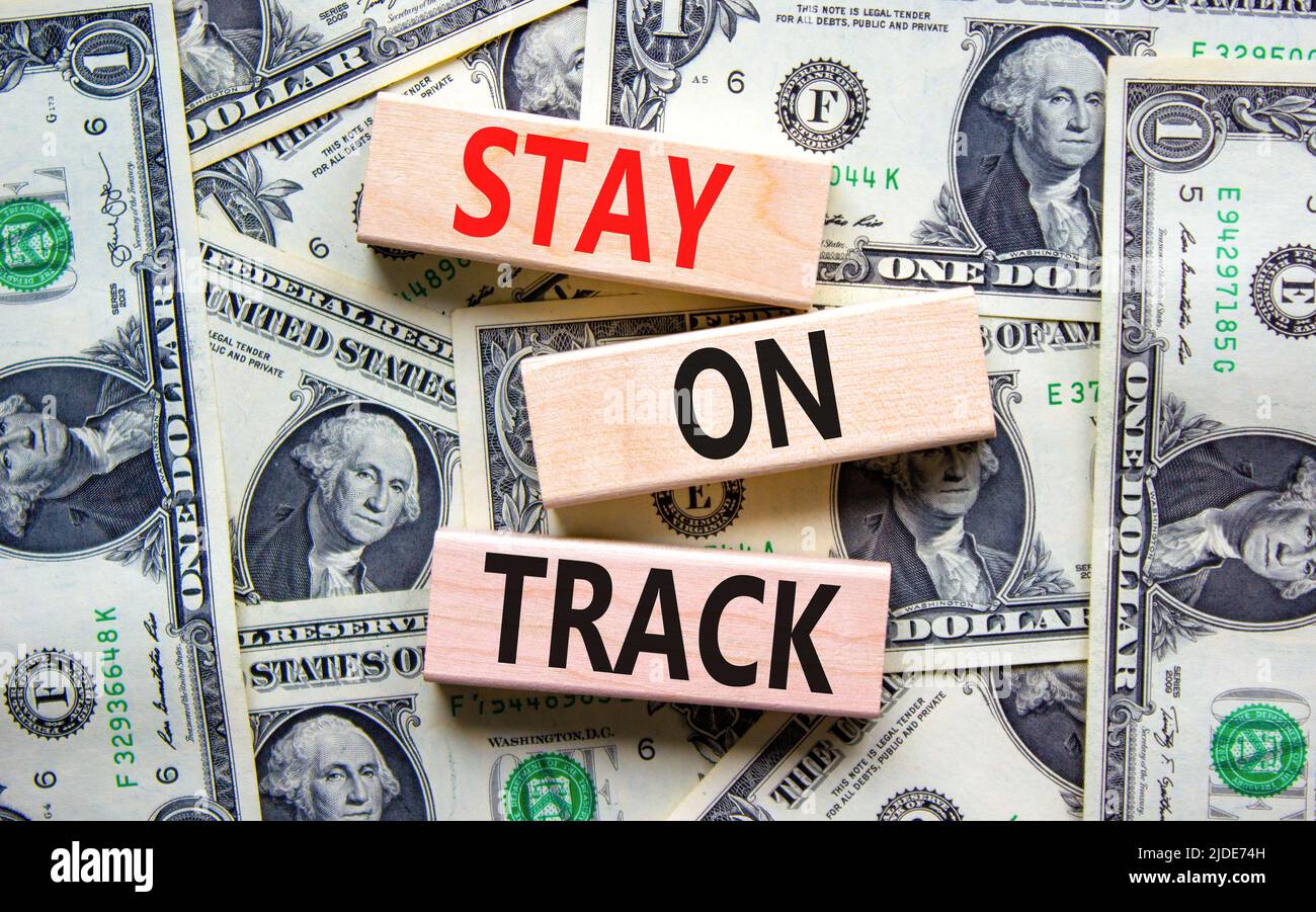 Stay on track symbol. Concept words Stay on track on wooden blocks on a ...