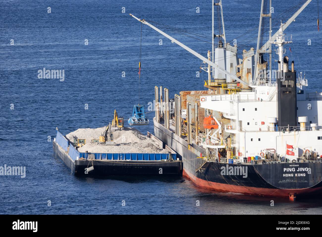 Port crane loading a barge hi-res stock photography and images - Alamy