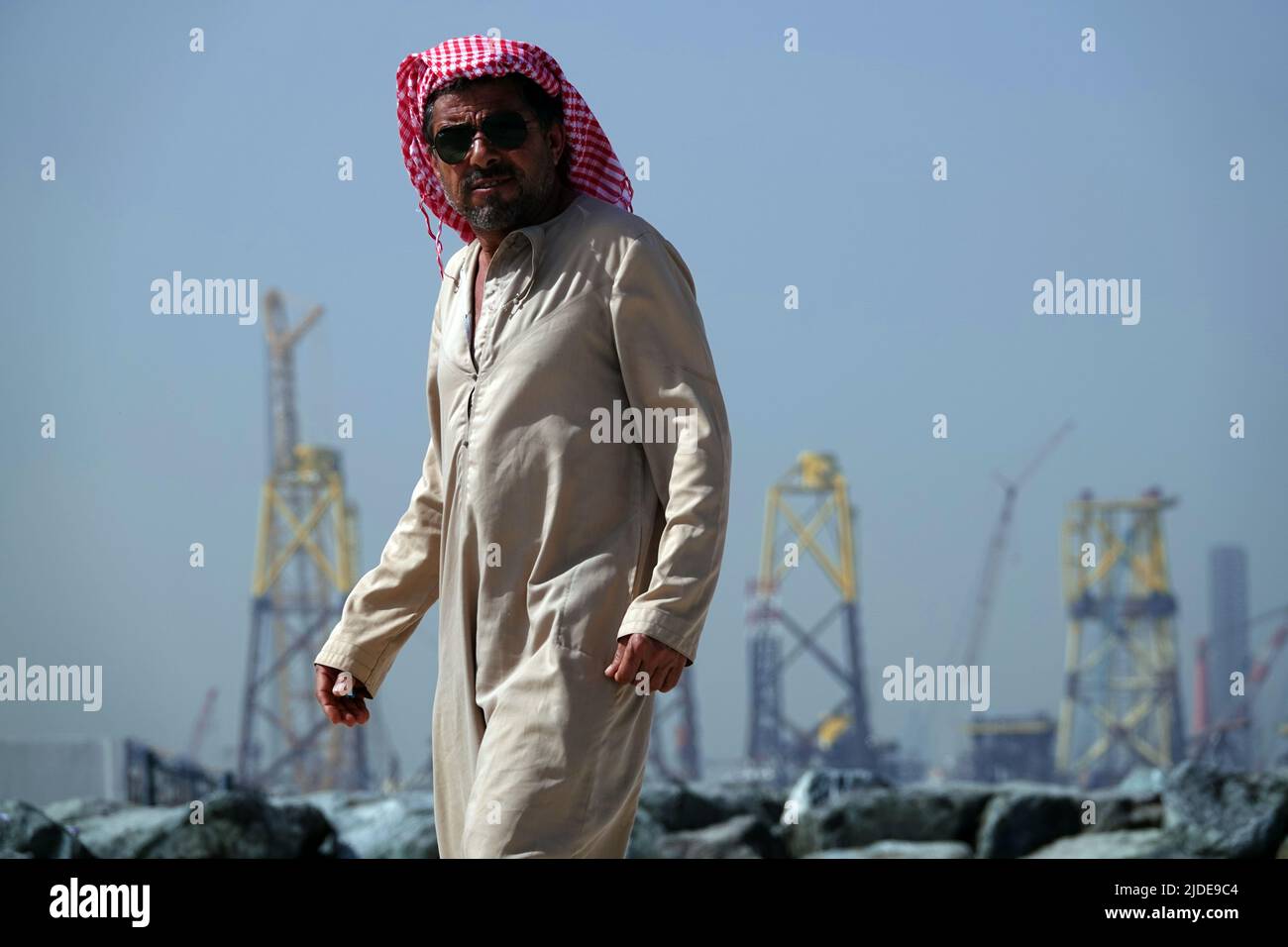Sharjah, UAE February 20, 2020: A man on the background of the ...