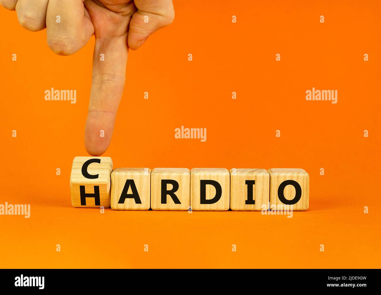 Cardio or hardio symbol. Businessman turns wooden cubes and changes ...