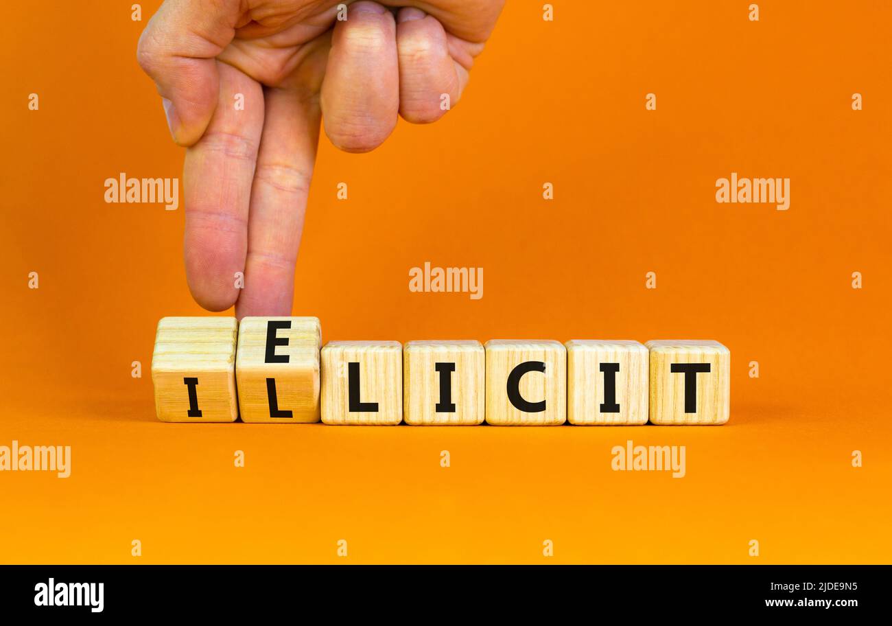 Illicit or elicit symbol. Businessman turns wooden cubes and changes ...