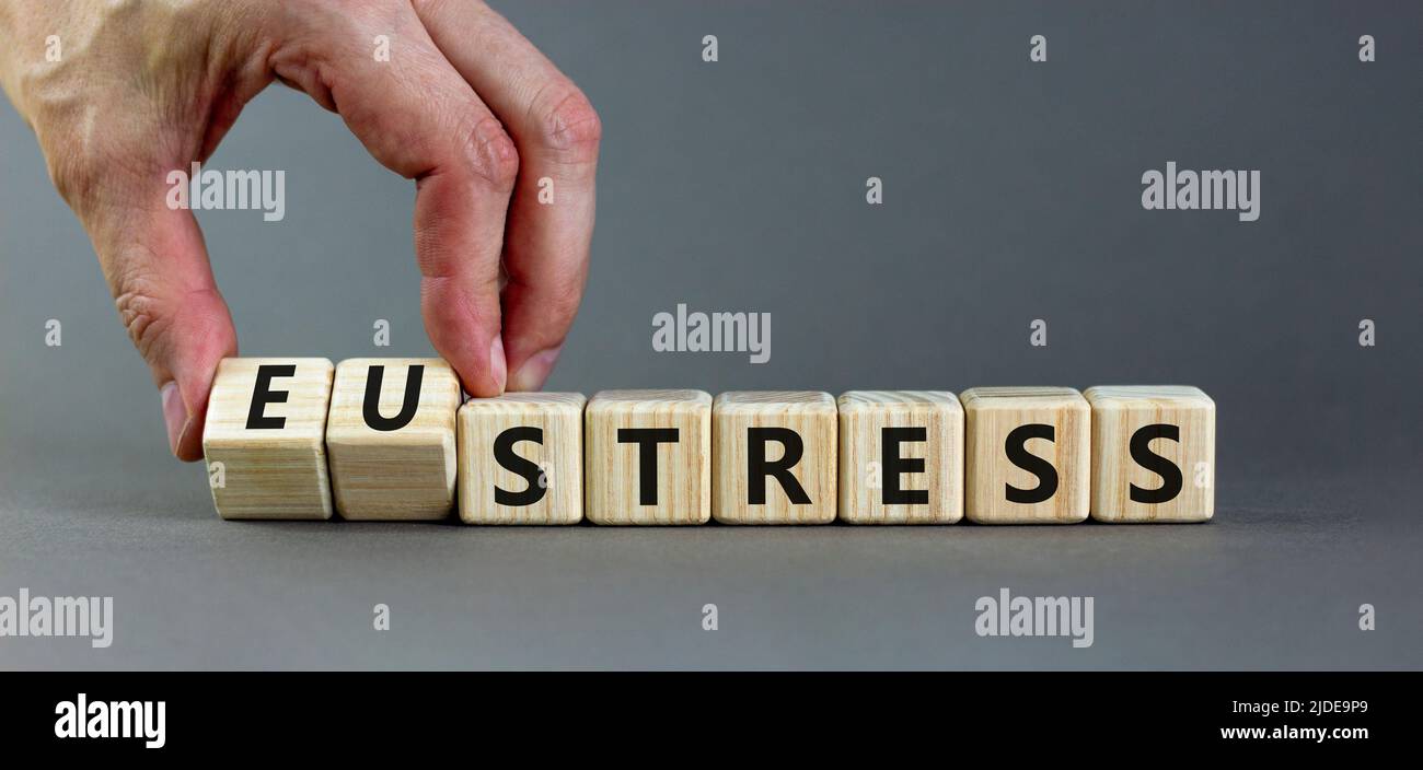 Eustress or stress symbol. Psychologist turns cubes and changes the ...