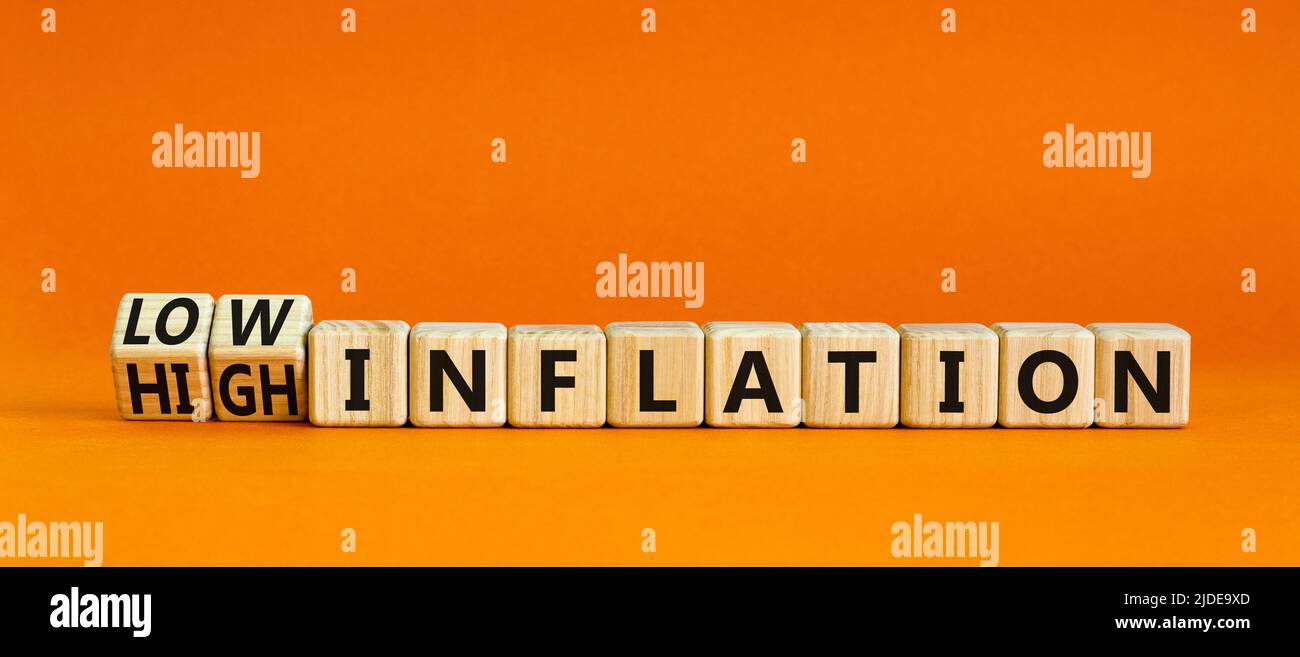High or low inflation symbol. Turned wooden cubes and changed concept ...