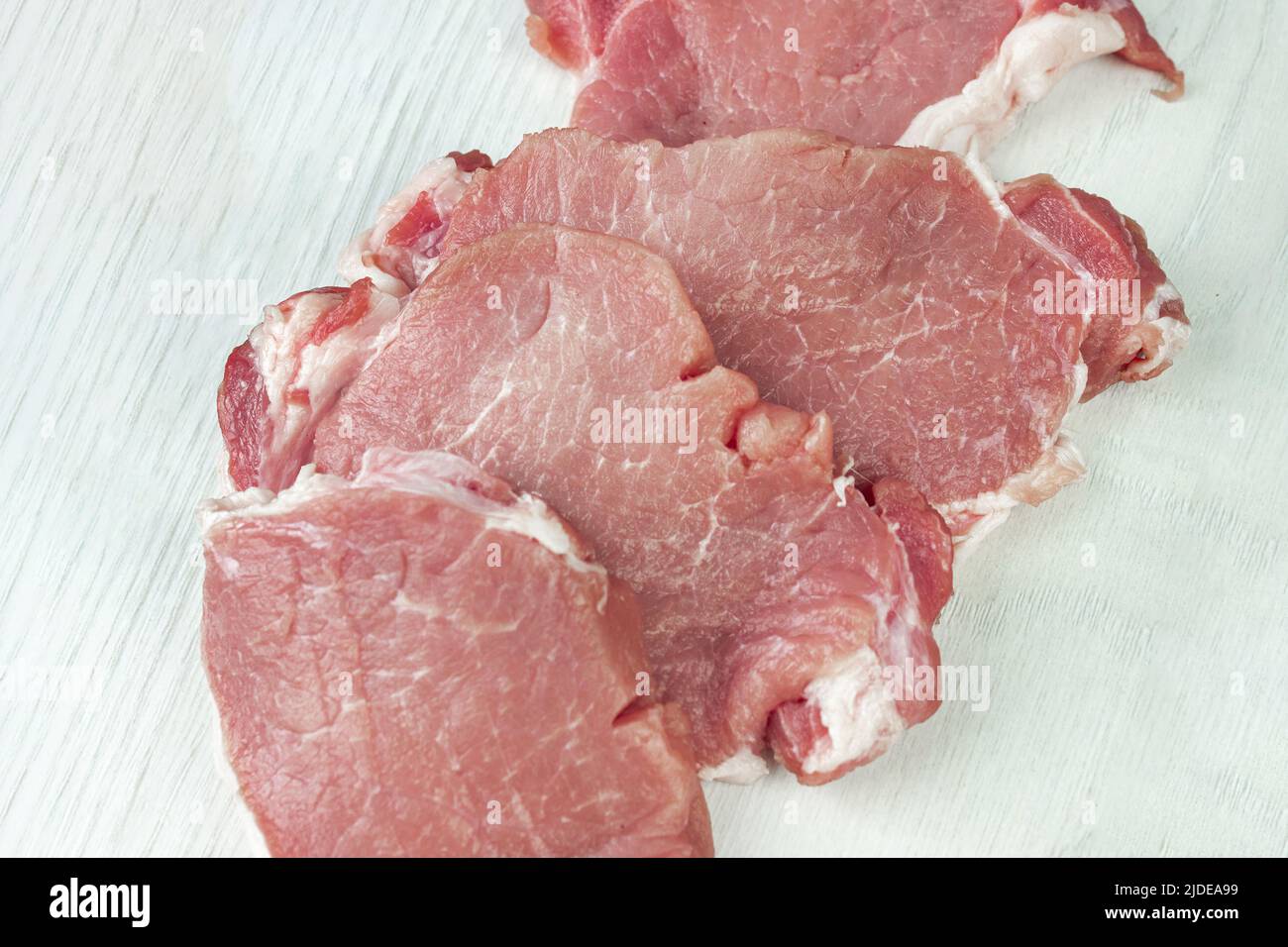 Raw steaks in row on white background. Fillet steak beef meat Stock ...