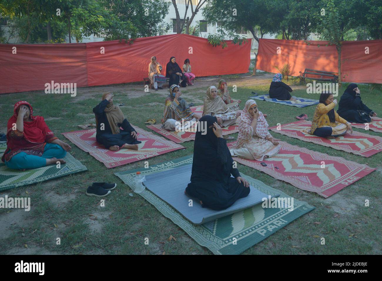 Lahore, Pakistan. 20th June, 2022. Pakistani people performing yoga ...