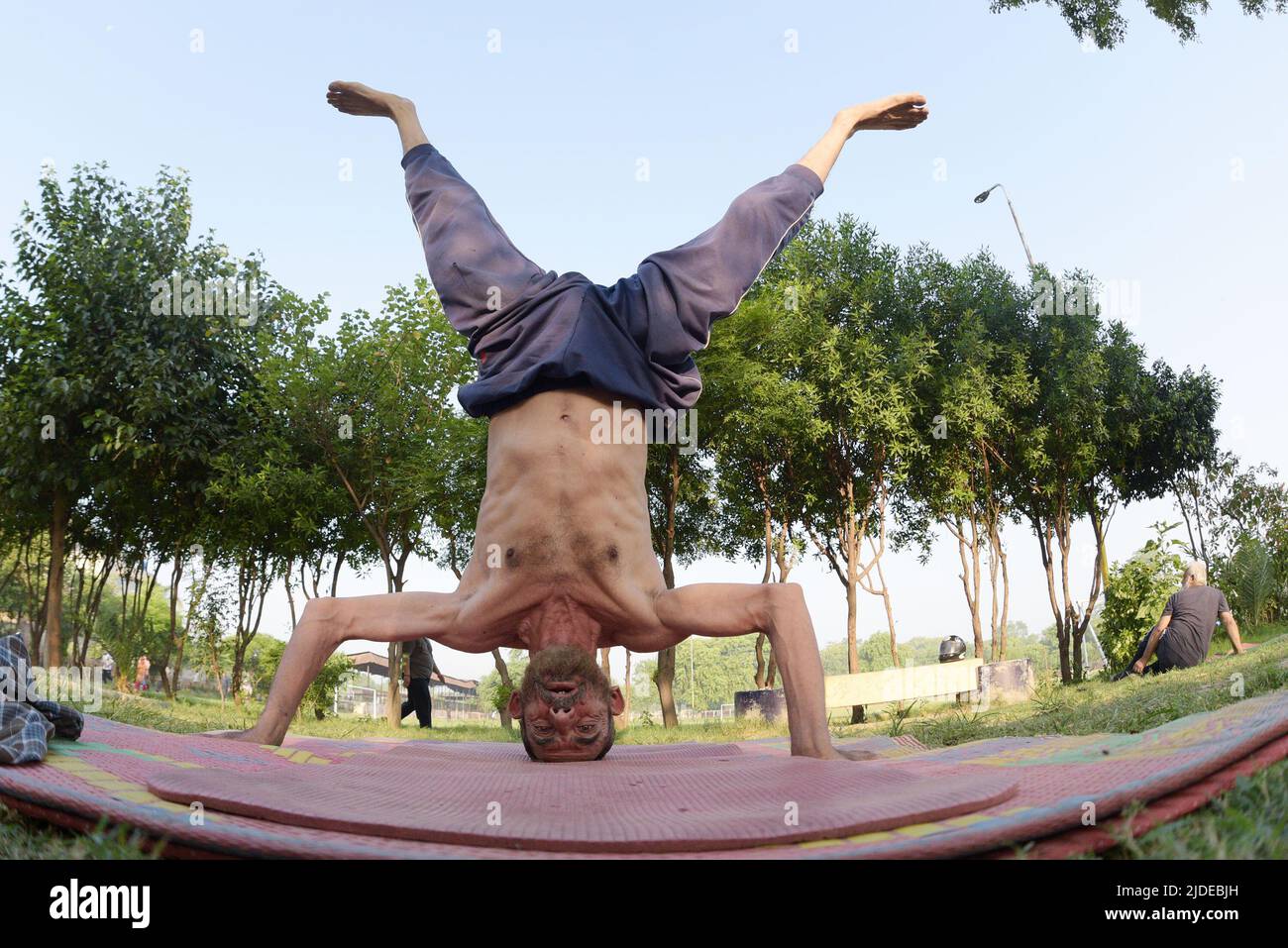 Lahore, Pakistan. 20th June, 2022. Pakistani people performing yoga ...