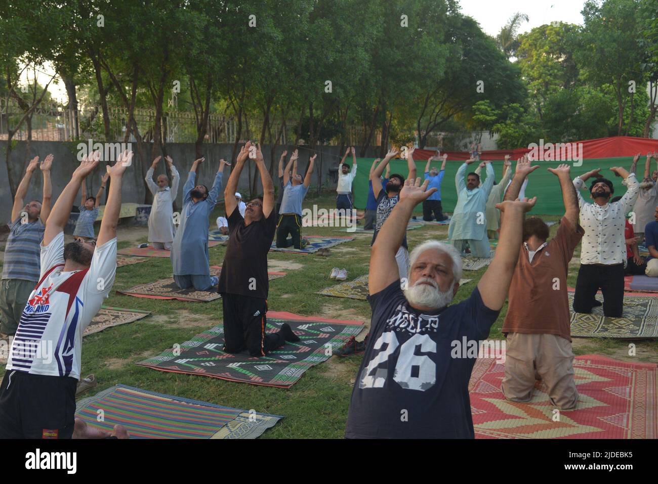 Lahore, Pakistan. 20th June, 2022. Pakistani people performing yoga ...