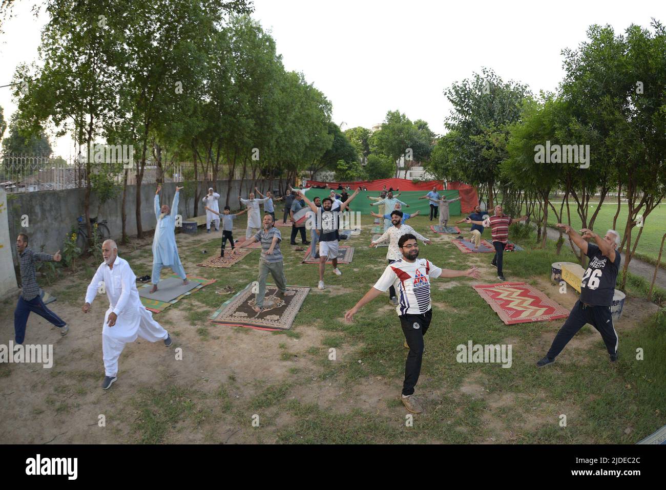 Lahore, Pakistan. 20th June, 2022. Pakistani people performing yoga ...