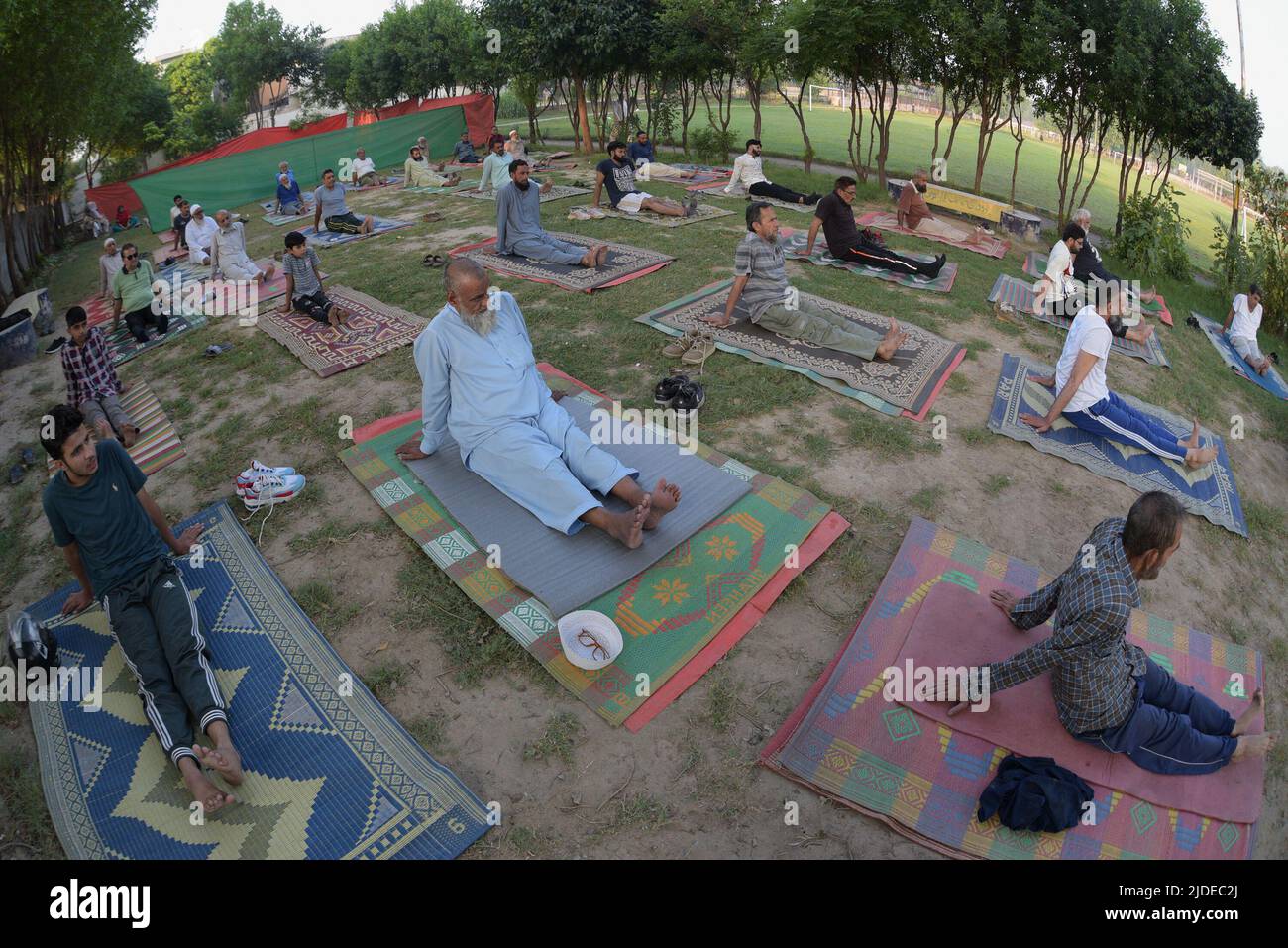 Lahore, Pakistan. 20th June, 2022. Pakistani people performing yoga ...