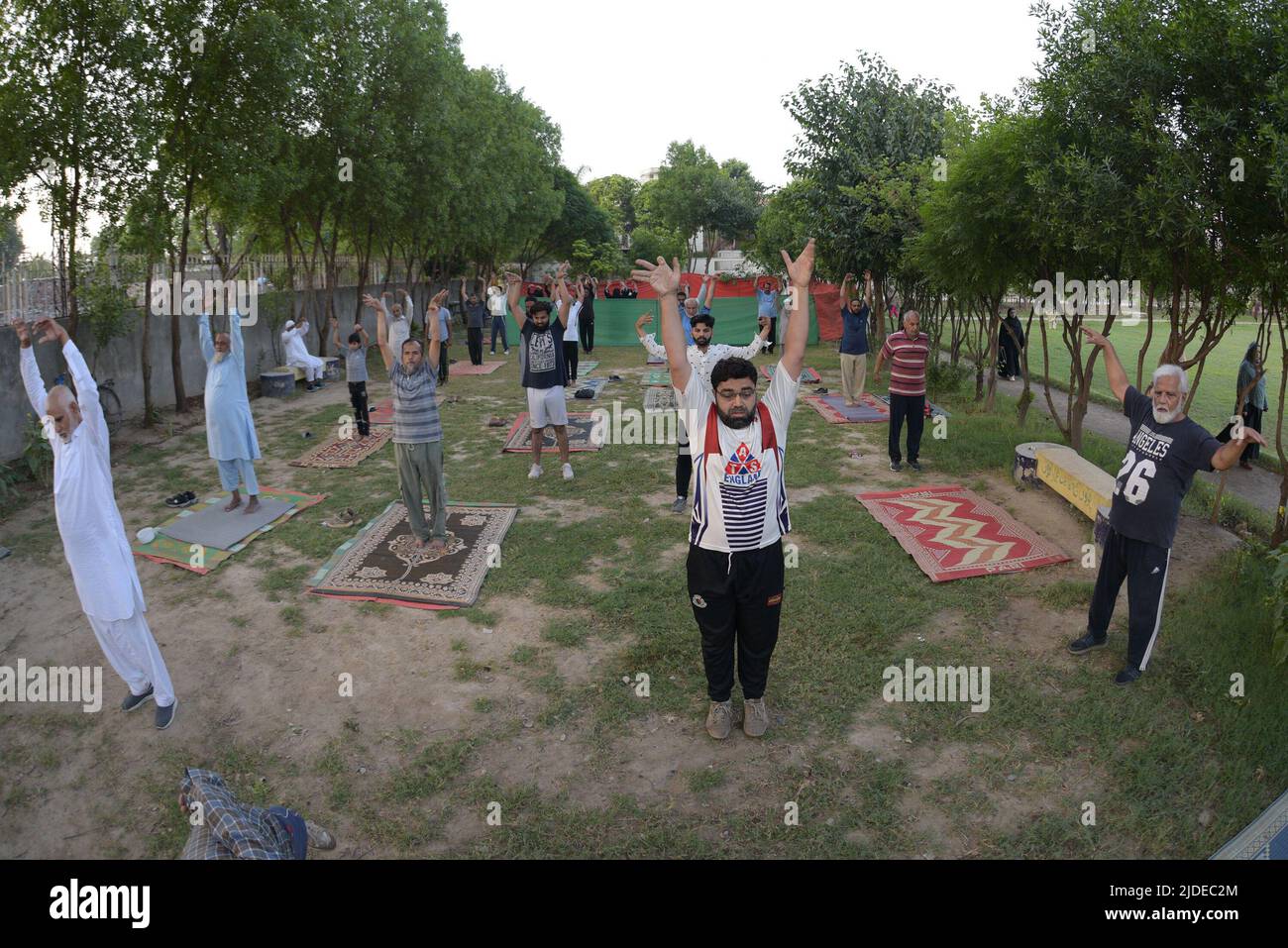 Lahore, Pakistan. 20th June, 2022. Pakistani people performing yoga ...