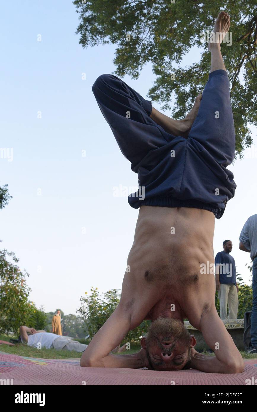Lahore, Pakistan. 20th June, 2022. Pakistani people performing yoga ...