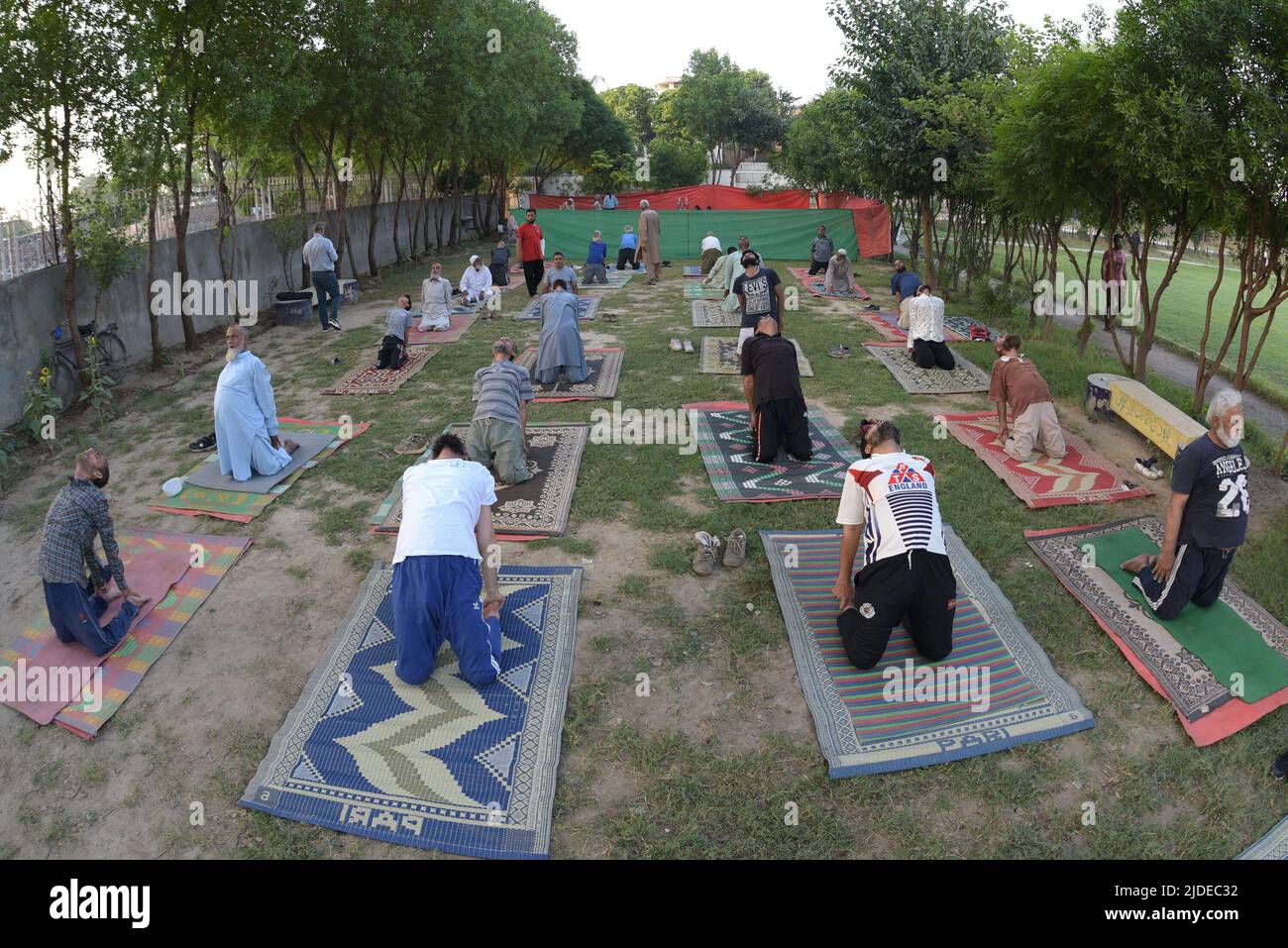 Lahore, Pakistan. 20th June, 2022. Pakistani people performing yoga ...