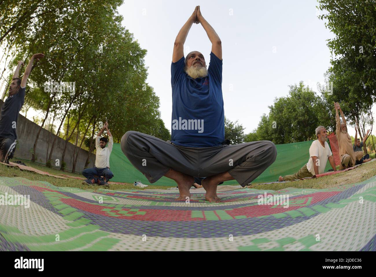 Lahore, Pakistan. 20th June, 2022. Pakistani people performing yoga ...