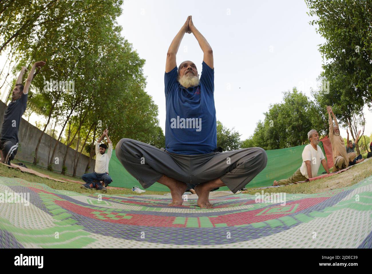 Lahore, Pakistan. 20th June, 2022. Pakistani people performing yoga ...