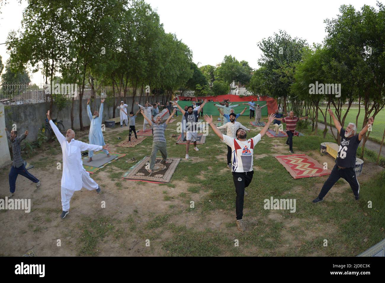 Lahore, Pakistan. 20th June, 2022. Pakistani people performing yoga ...