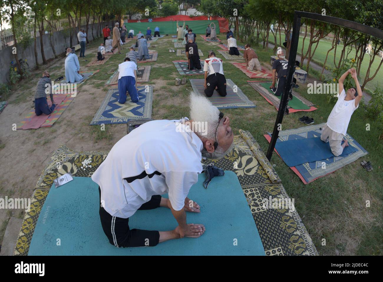 Lahore, Pakistan. 20th June, 2022. Pakistani people performing yoga ...